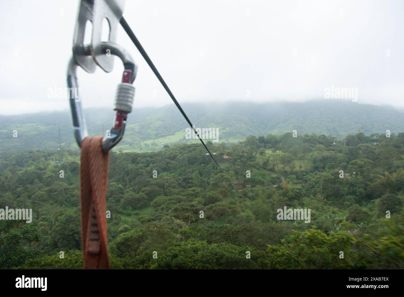 Zip-lining above the rainforest canopy in Ecuador as adventure ...