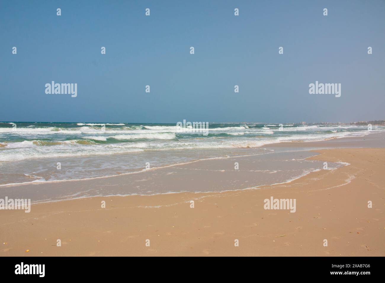 Overhead photo of crashing waves on the shoreline beach. Tropical beach ...
