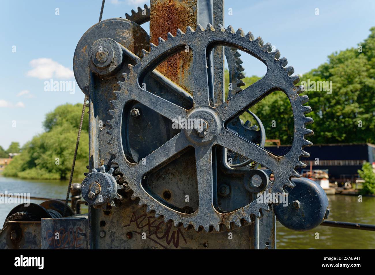Cog wheel of a historic crane at Isleworth on the River Thames, London ...