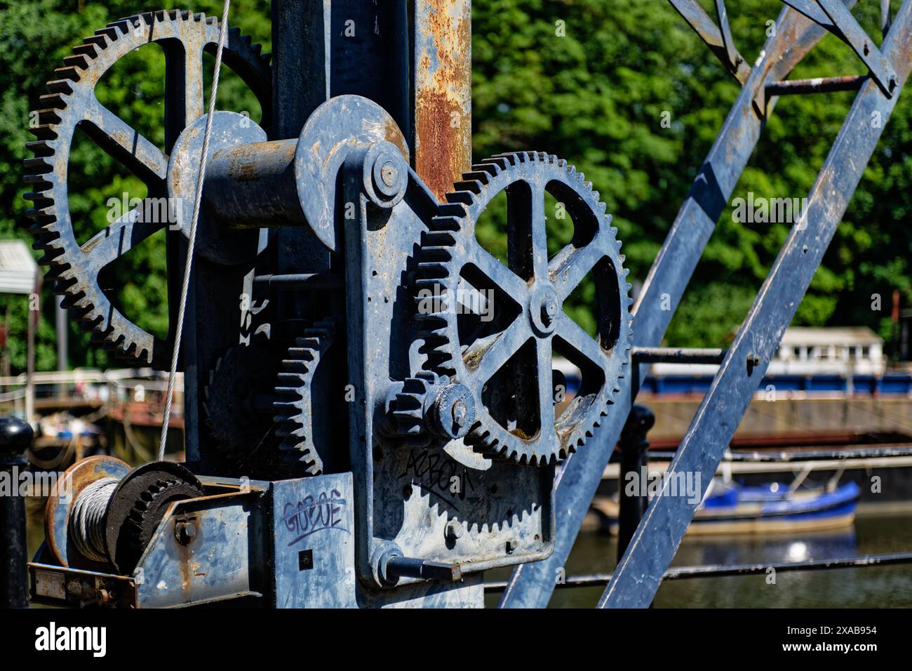 Cog wheel of a historic crane at Isleworth on the River Thames, London ...