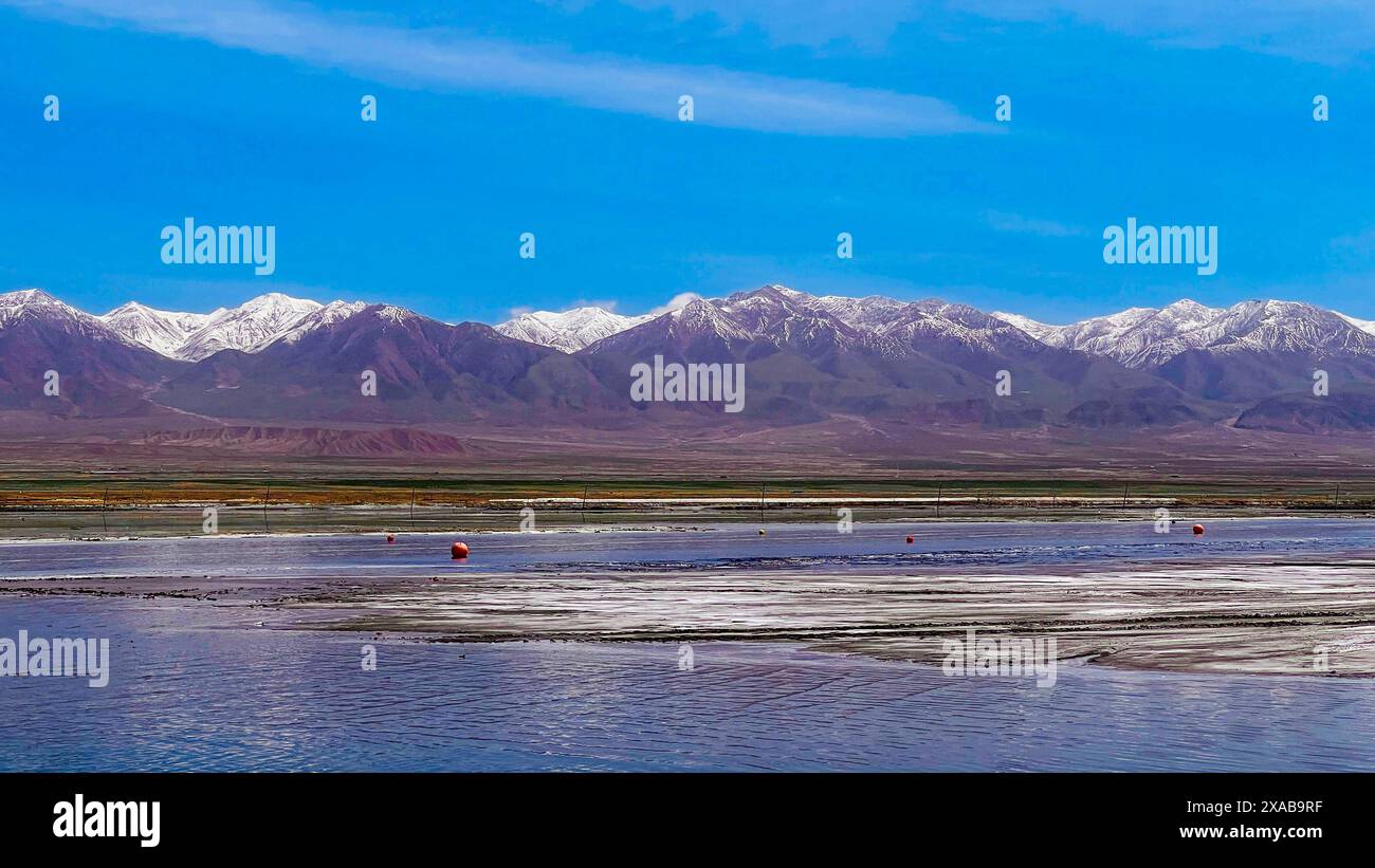HAIXI, CHINA - JUNE 5, 2024 - Snow-capped mountains, blue sky and white ...