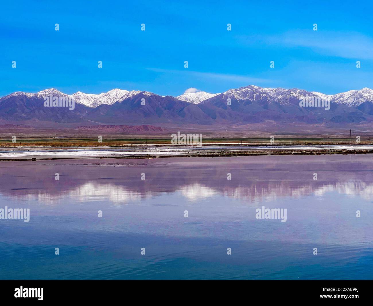 HAIXI, CHINA - JUNE 5, 2024 - Snow-capped mountains, blue sky and white ...