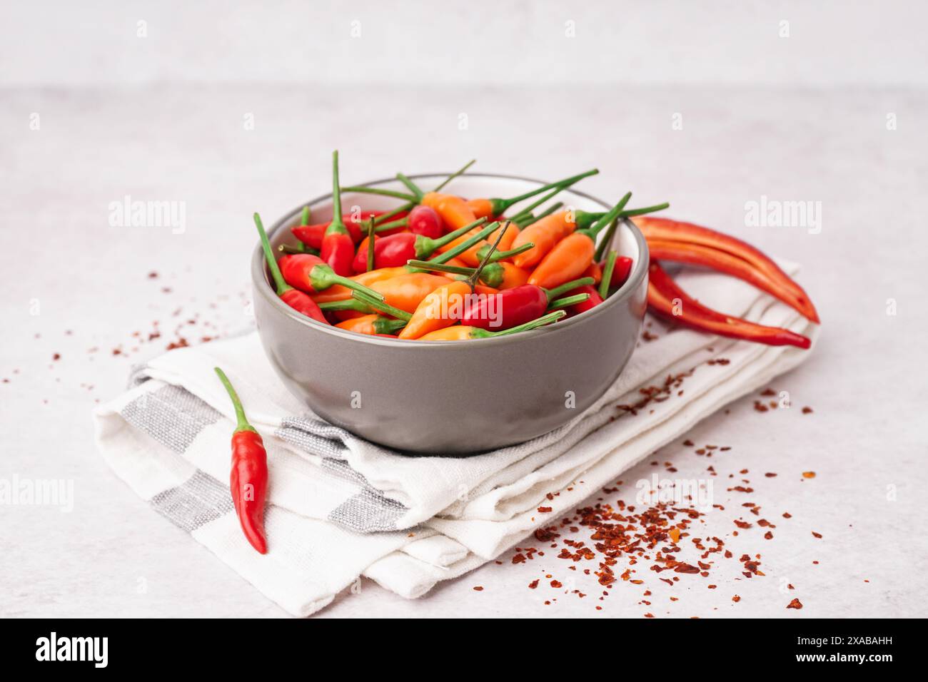 Bowl with fresh chili peppers on white background Stock Photo - Alamy