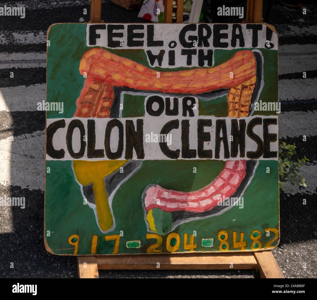 Vendor promotes a colon cleanse at a street fair in New York on ...