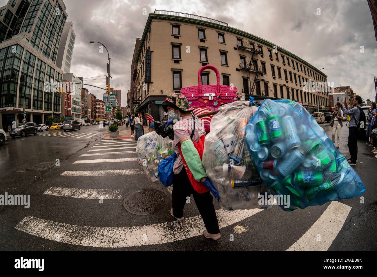 Asian woman with a collection of recyclables for redemption on the ...