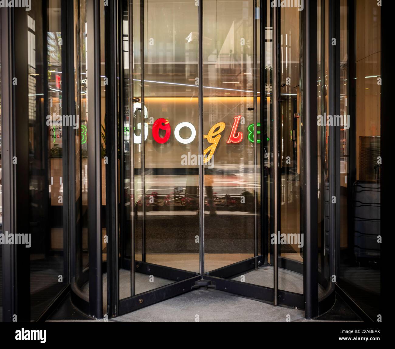 Illuminated sign greets visitors at the entrance to the Google building ...
