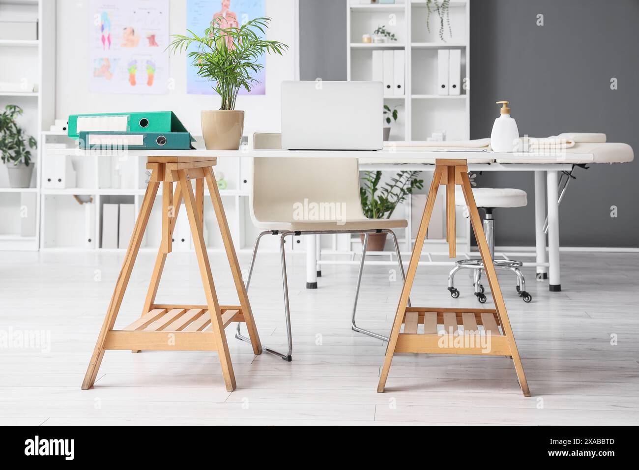 Massage therapist's workplace with laptop in medical office Stock Photo ...