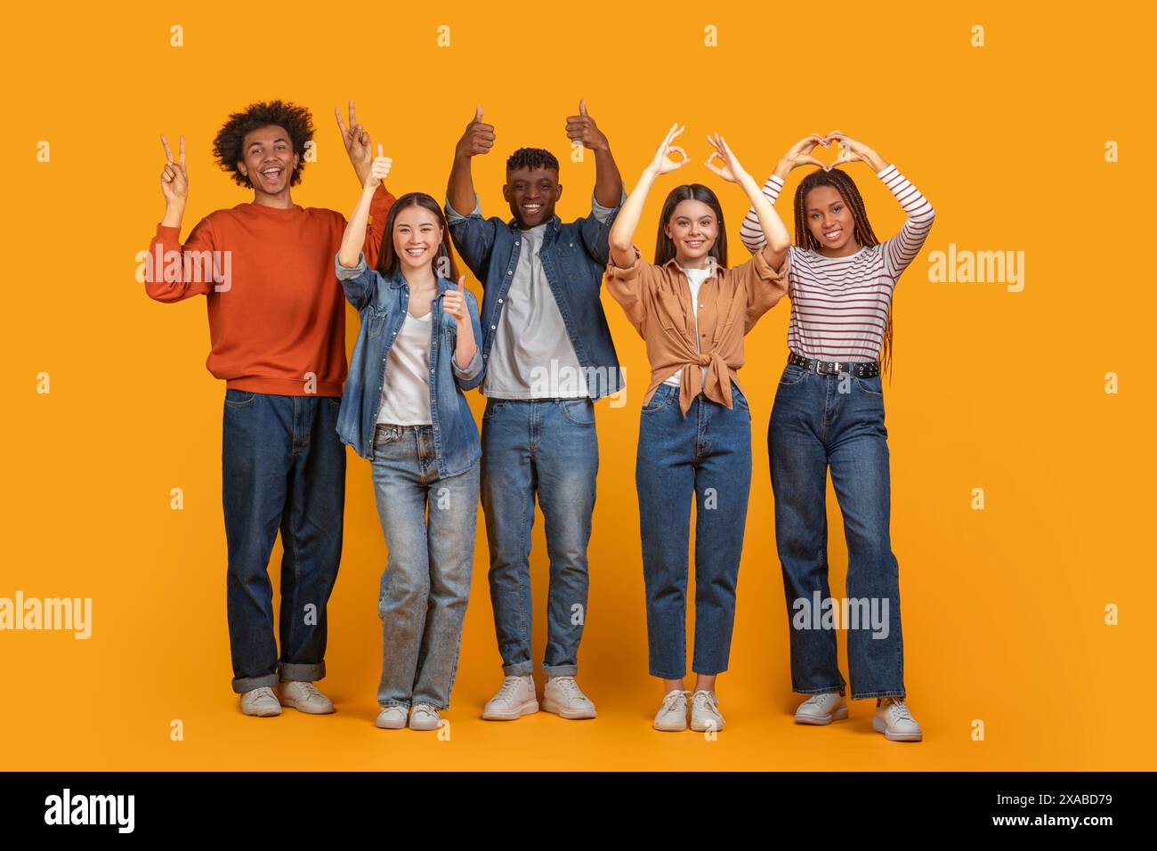 Diverse Friends Posing With Hand Gestures in Front Stock Photo - Alamy