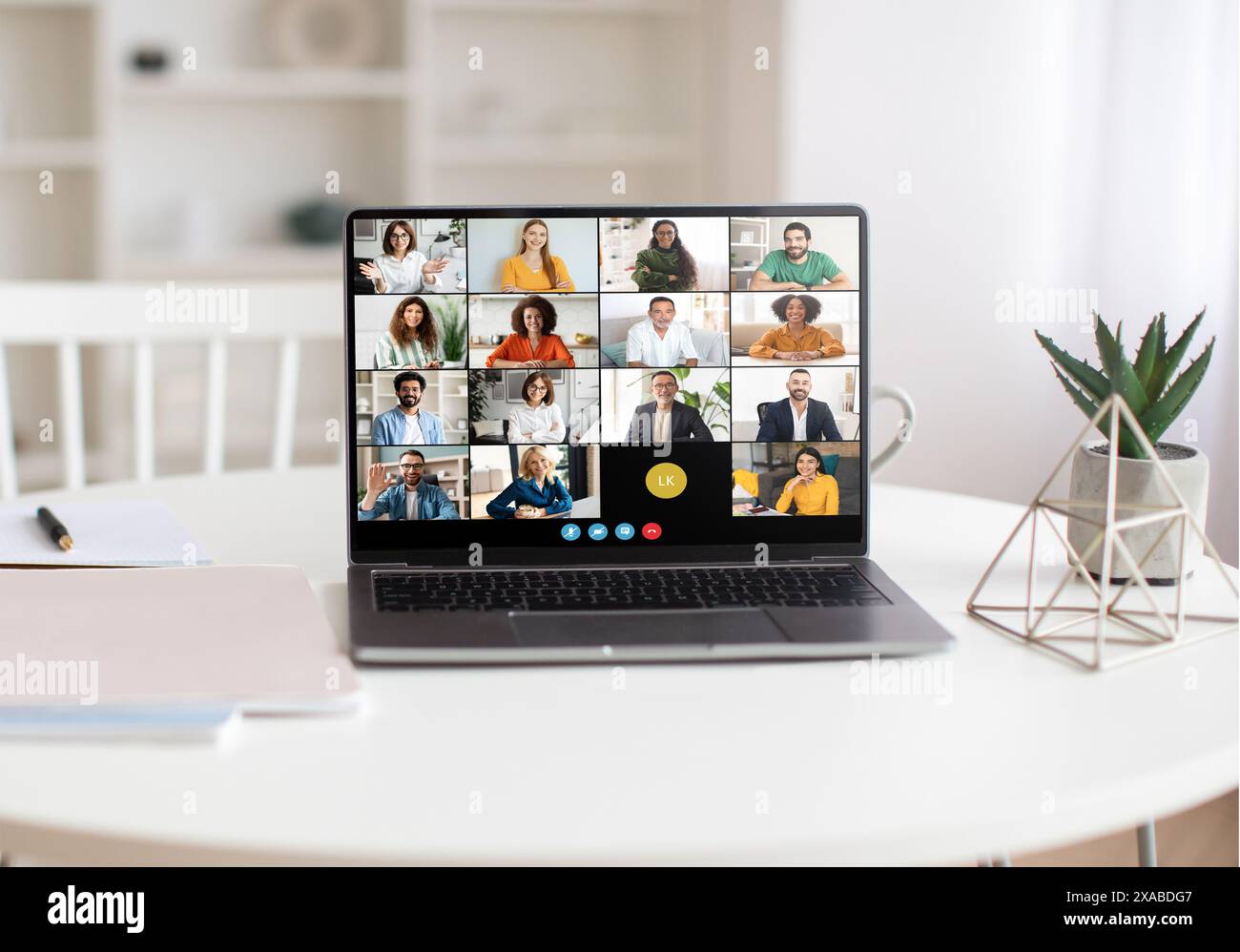 Virtual Team Meeting on Laptop in a Bright Home Office Stock Photo - Alamy