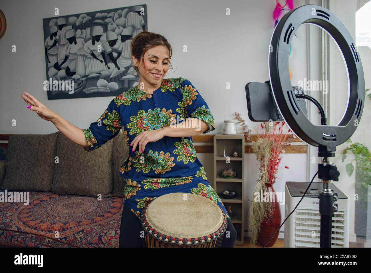 Attractive woman dancing filming herself hi-res stock photography and ...