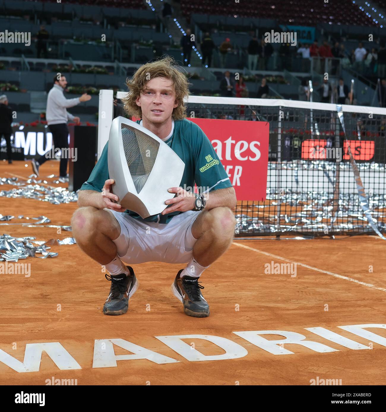 Andrey Rublev poses with the Mutua Madrid Open trophy following victory ...
