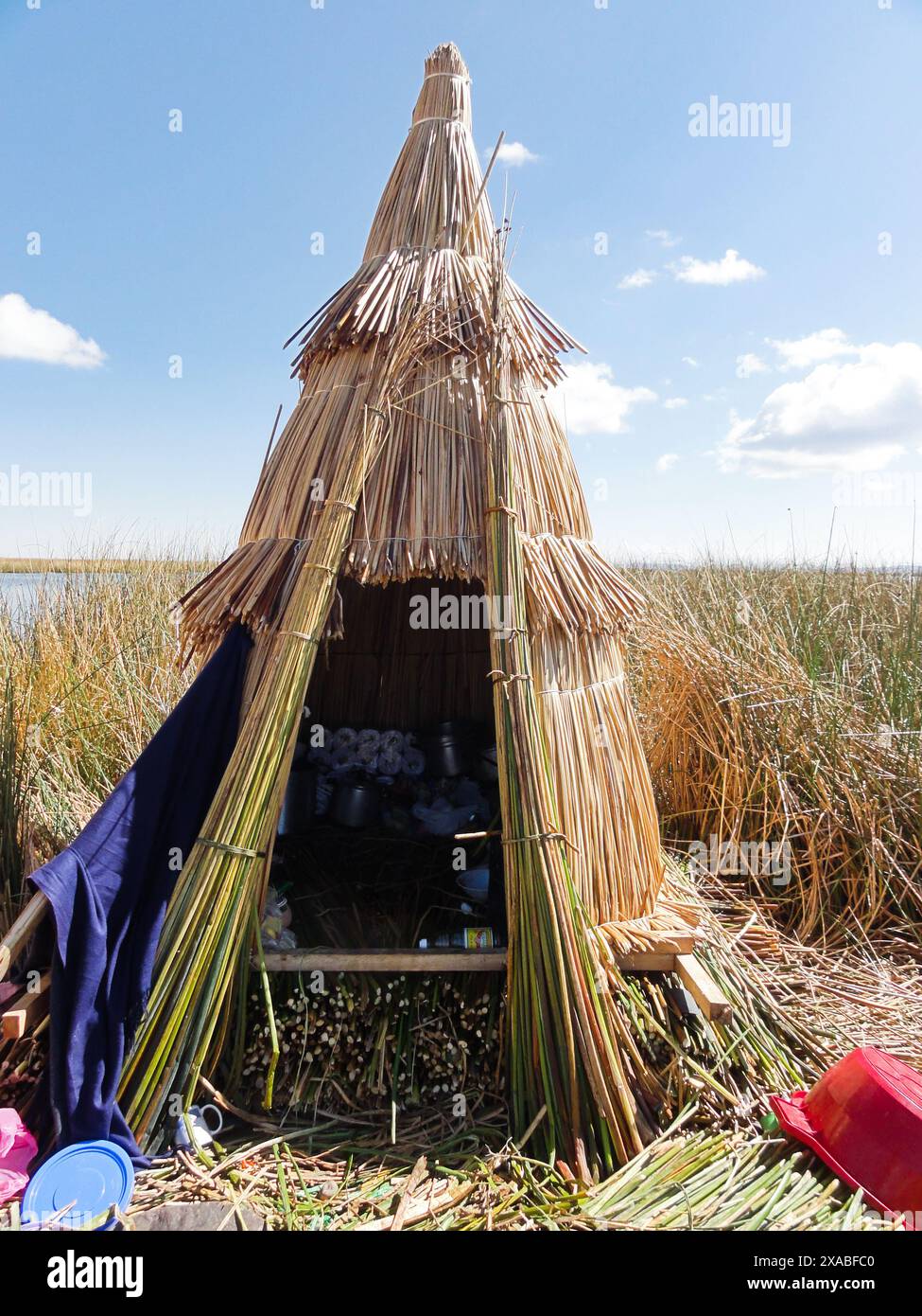 Rustic reed hut on the floating islands of puno, showcasing indigenous ...