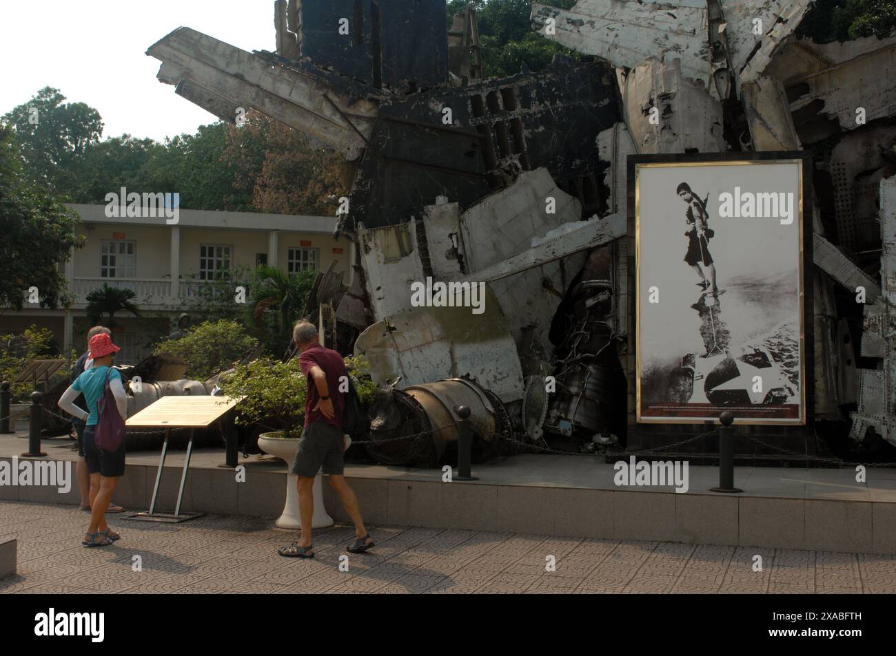 Tourists visiting the smashed American combat aircraft constructed as a ...