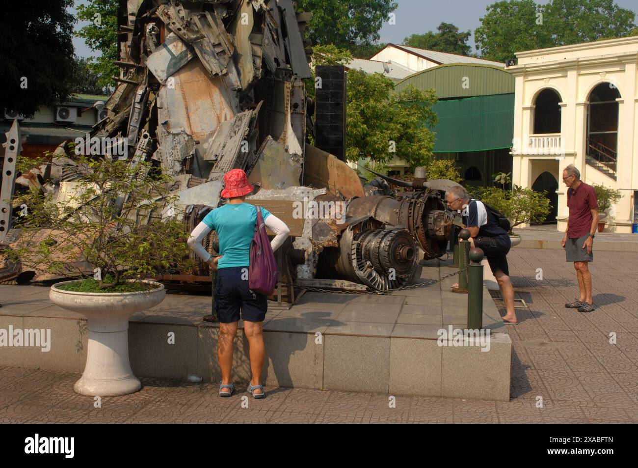Tourists visiting the smashed American combat aircraft constructed as a ...