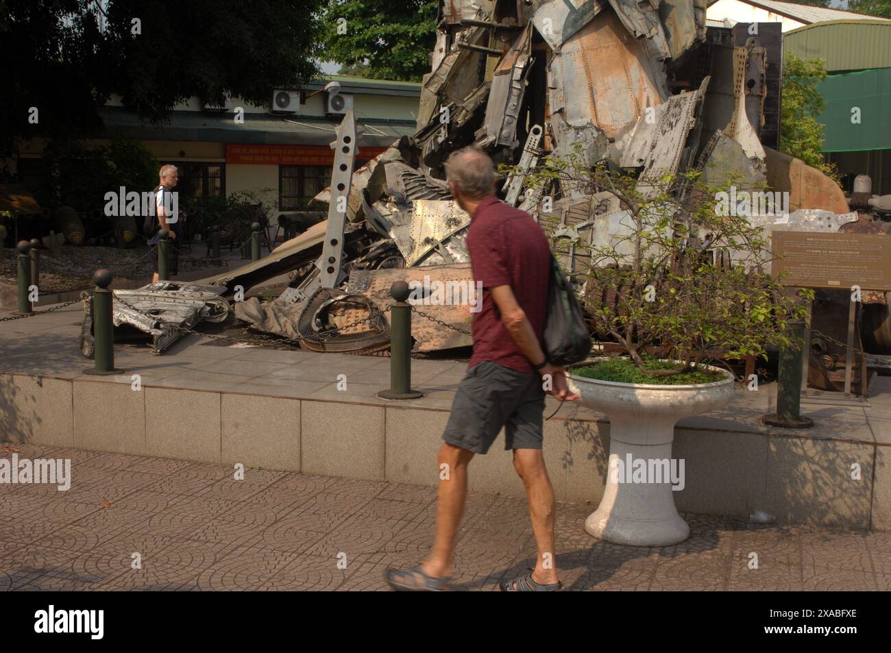 Tourists visiting the smashed American combat aircraft constructed as a ...