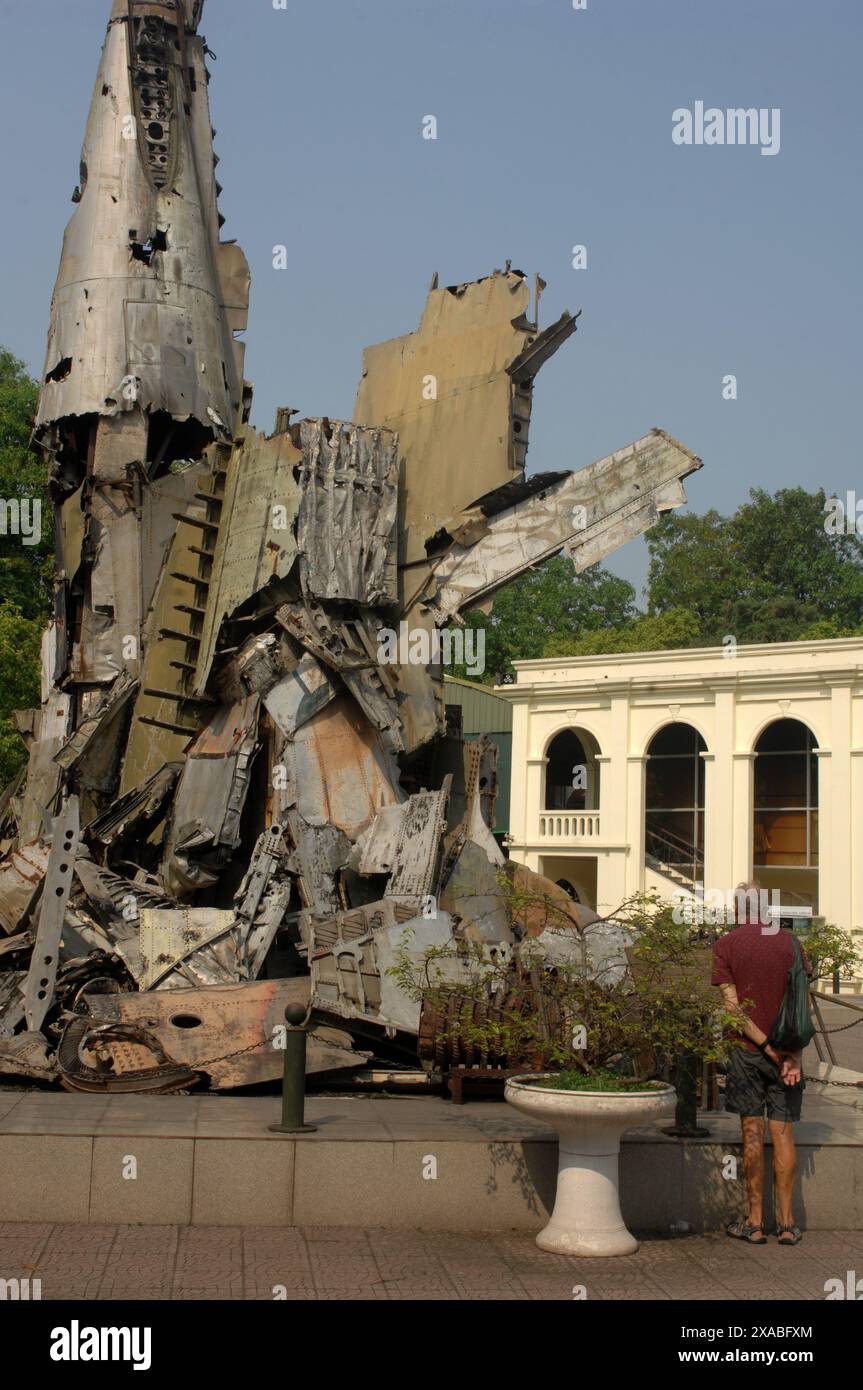 Tourists visiting the smashed American combat aircraft constructed as a ...