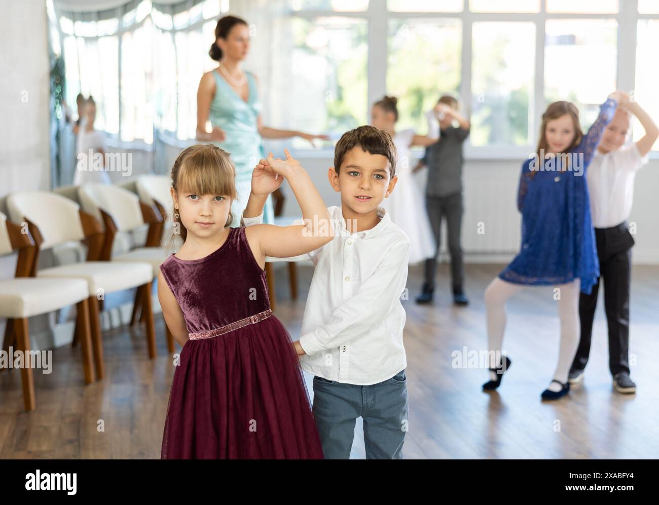Preteen pupils rehearsing ballroom dance for festive school event Stock ...