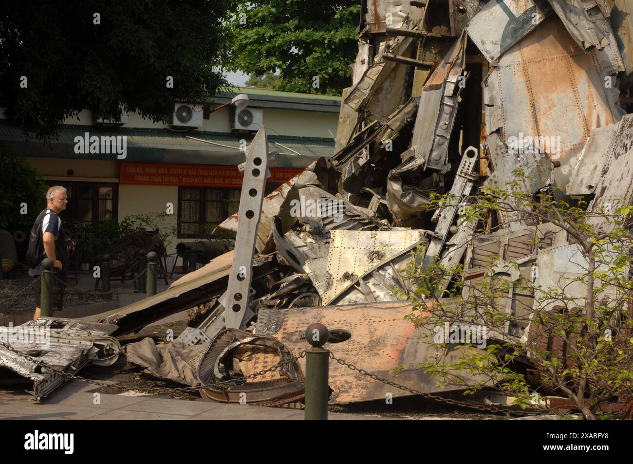 Tourists visiting the smashed American combat aircraft constructed as a ...