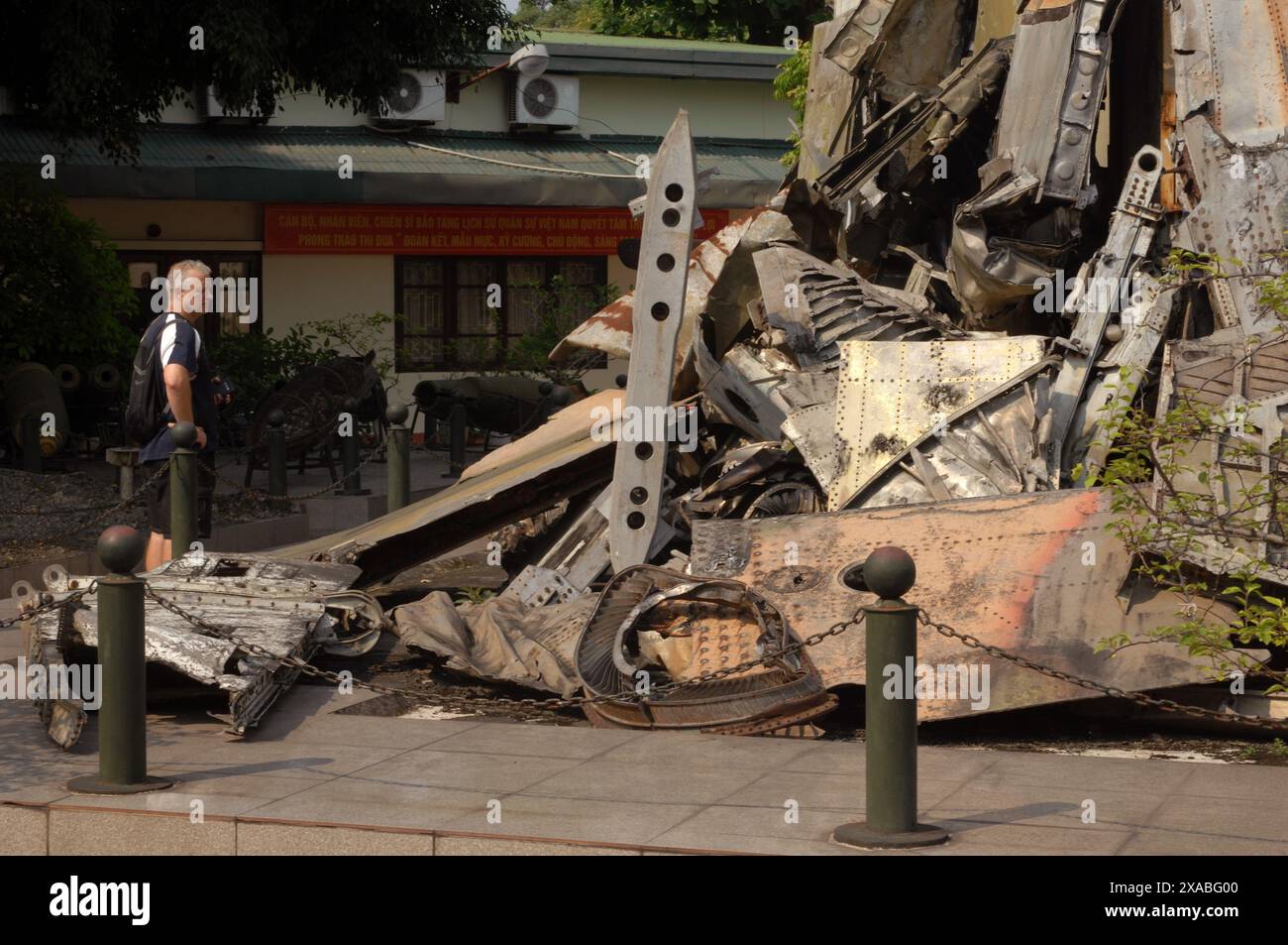 Tourists visiting the smashed American combat aircraft constructed as a ...