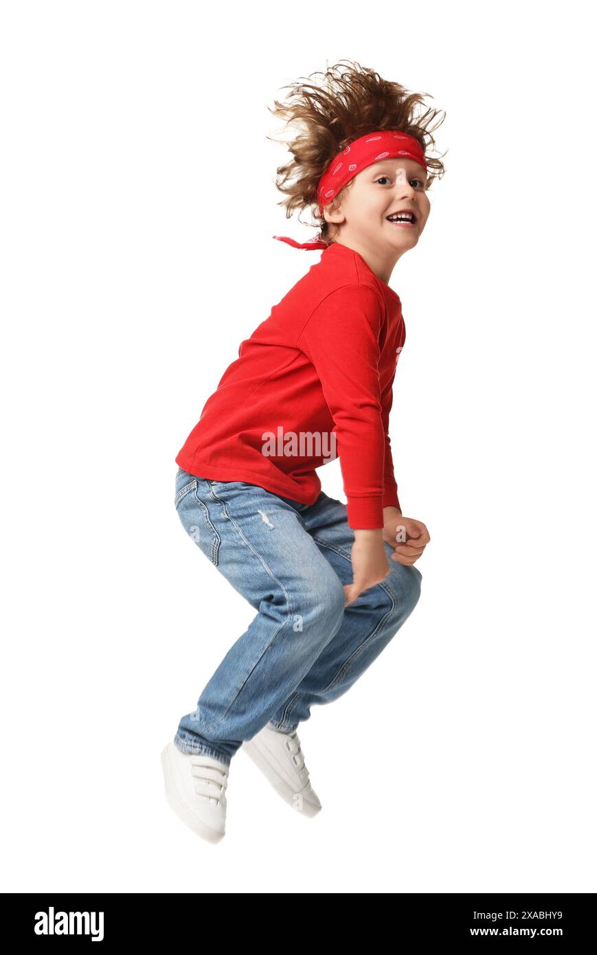 Happy little boy dancing on white background Stock Photo - Alamy