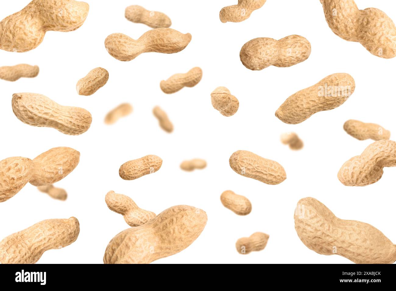 Unpeeled peanuts in air on white background Stock Photo - Alamy