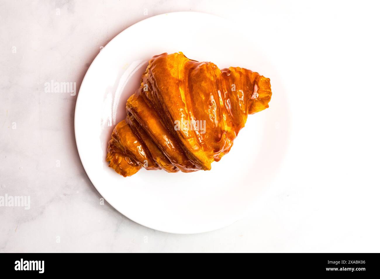 Salted caramel croissant Stock Photo - Alamy