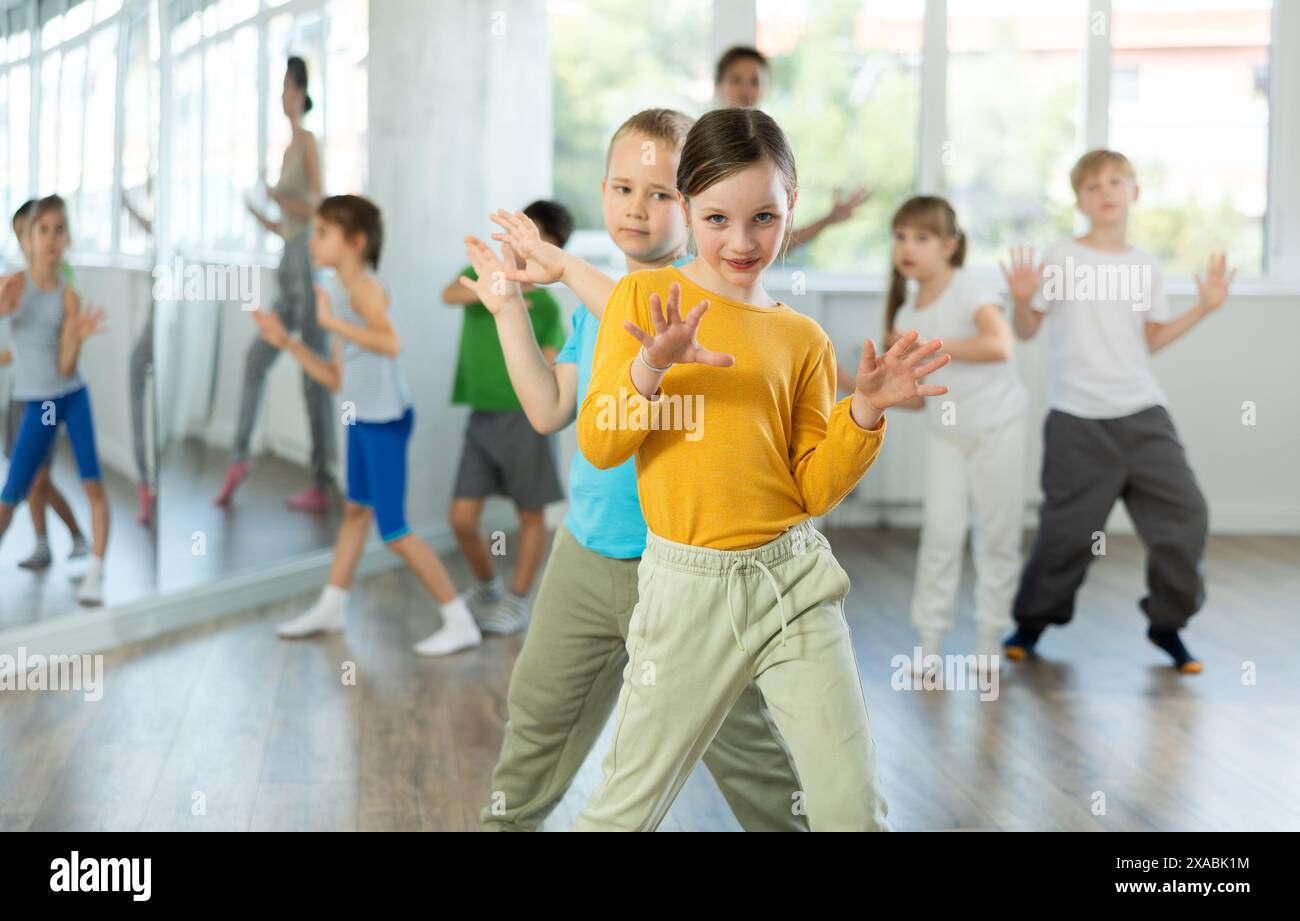 Dance lesson for children - girls and boys learn modern dances in pairs ...