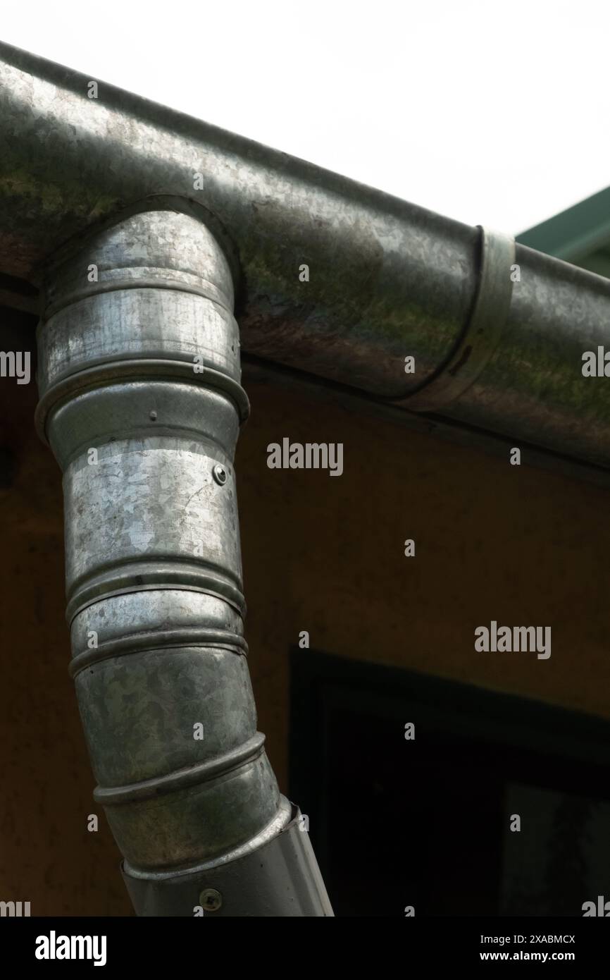 Rain water gutter under the roof of the house. Rain water harvesting ...