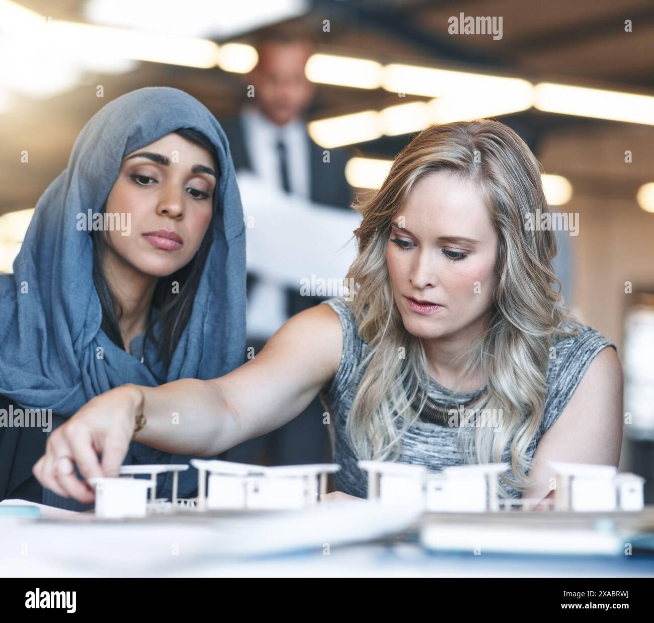 Women, architecture team and model in office for building design ...