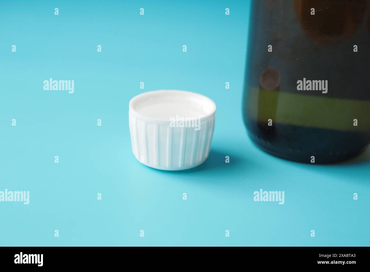 A dose of cough syrup Stock Photo - Alamy