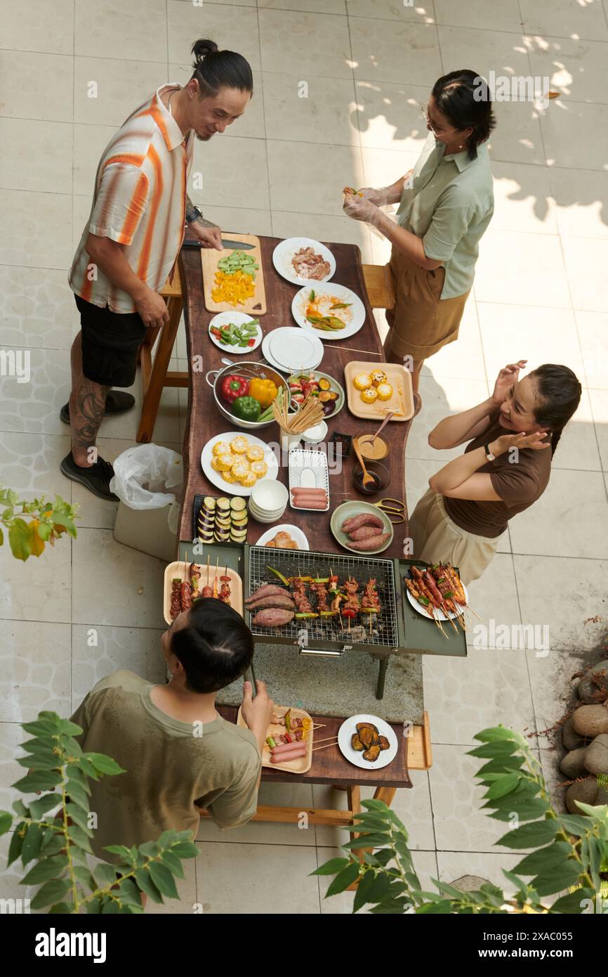 Friends together table delicious hi-res stock photography and images ...