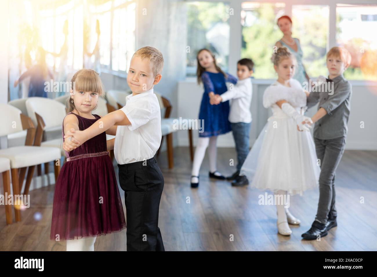 Preteen pupils rehearsing ballroom dance for festive school event Stock ...