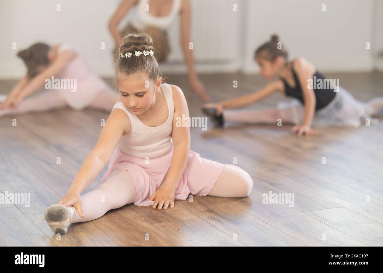 Girl dancer doing stretching in studio Stock Photo - Alamy