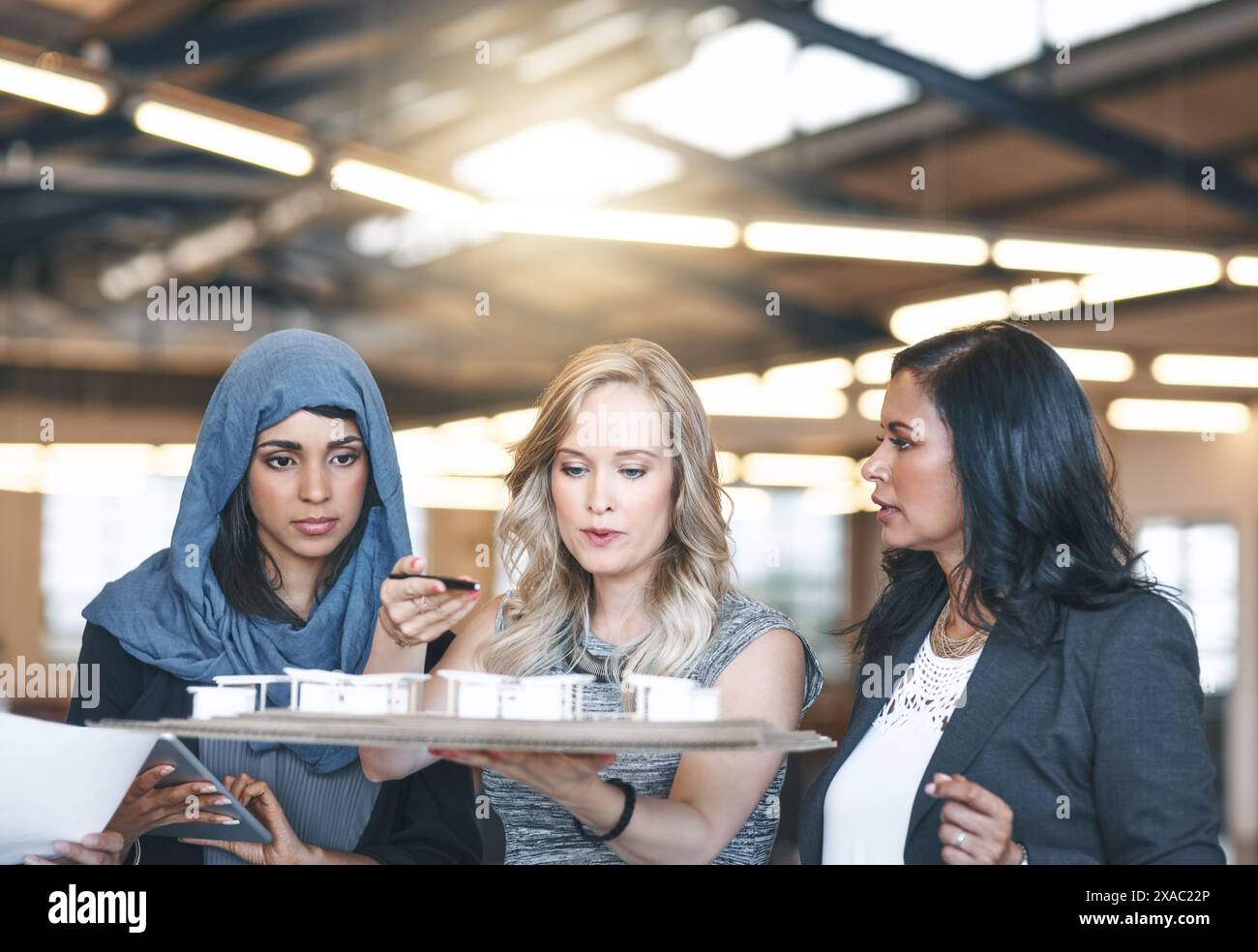 Women, architect group and model in office for building design ...