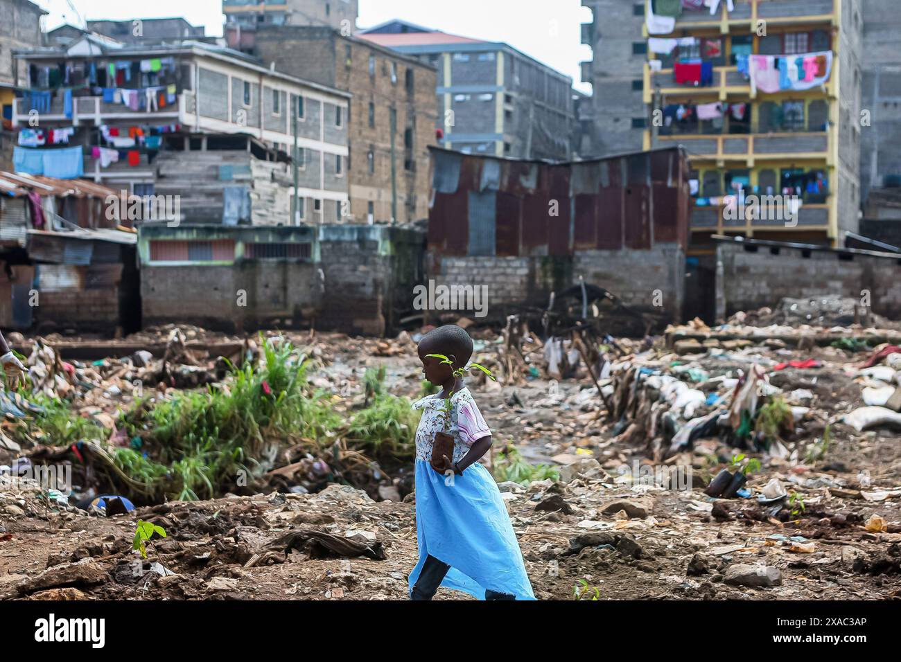 Zamzam Mike Mariam a four year old Kenyan girl walks along the Mathare ...