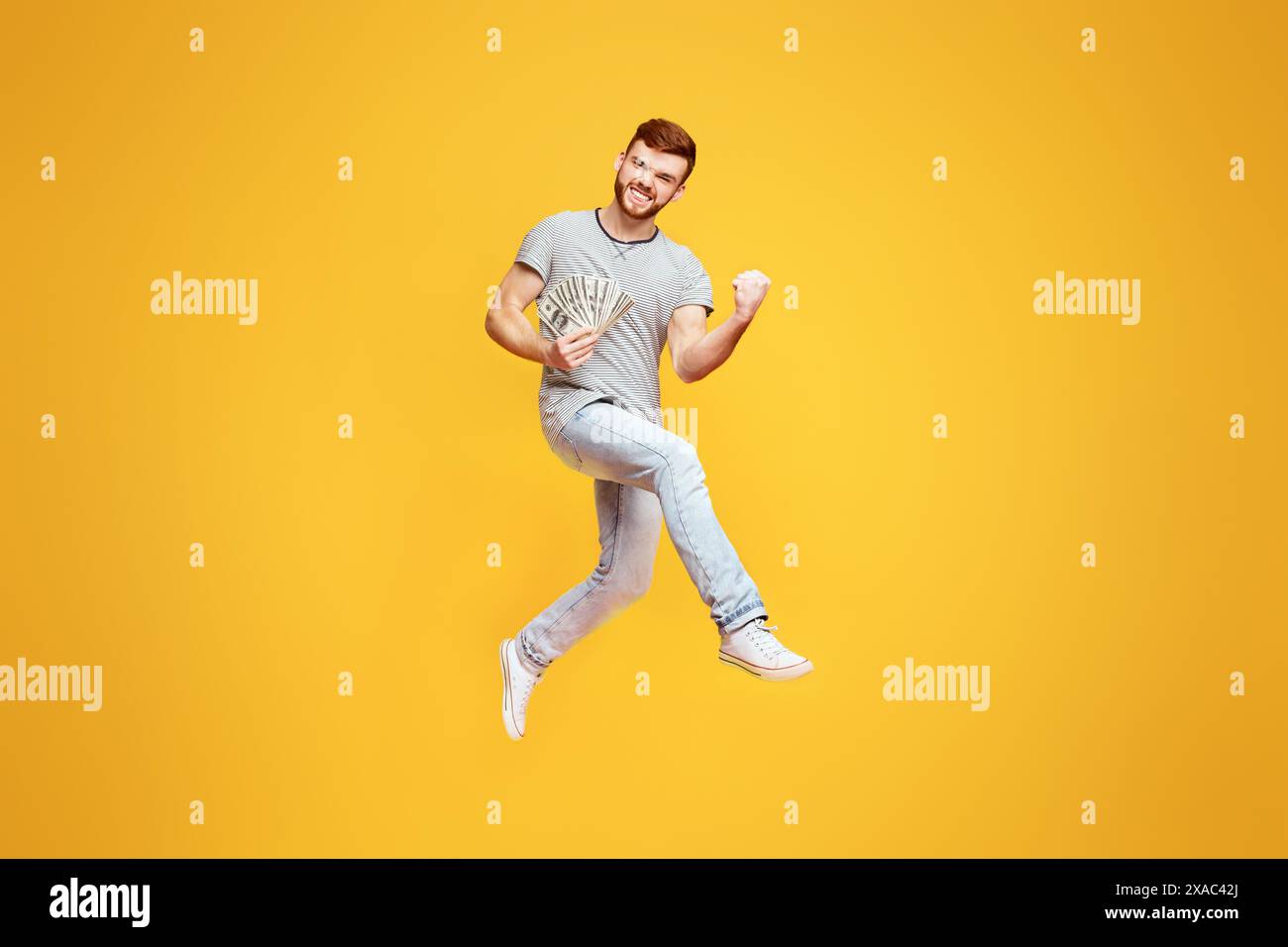 Excited handsome man celebrating hi-res stock photography and images ...