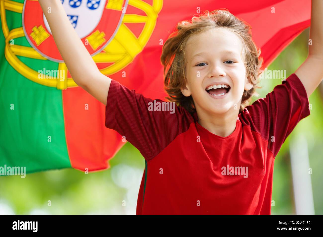 Portugal football supporter kid on stadium. Portuguese soccer fan boy ...