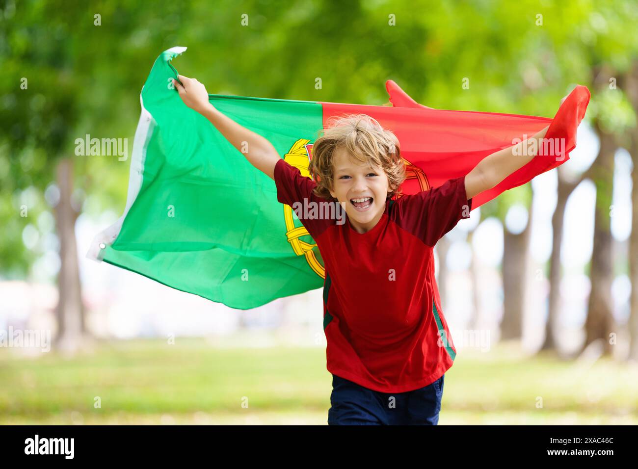 Portugal football supporter kid on stadium. Portuguese soccer fan boy ...