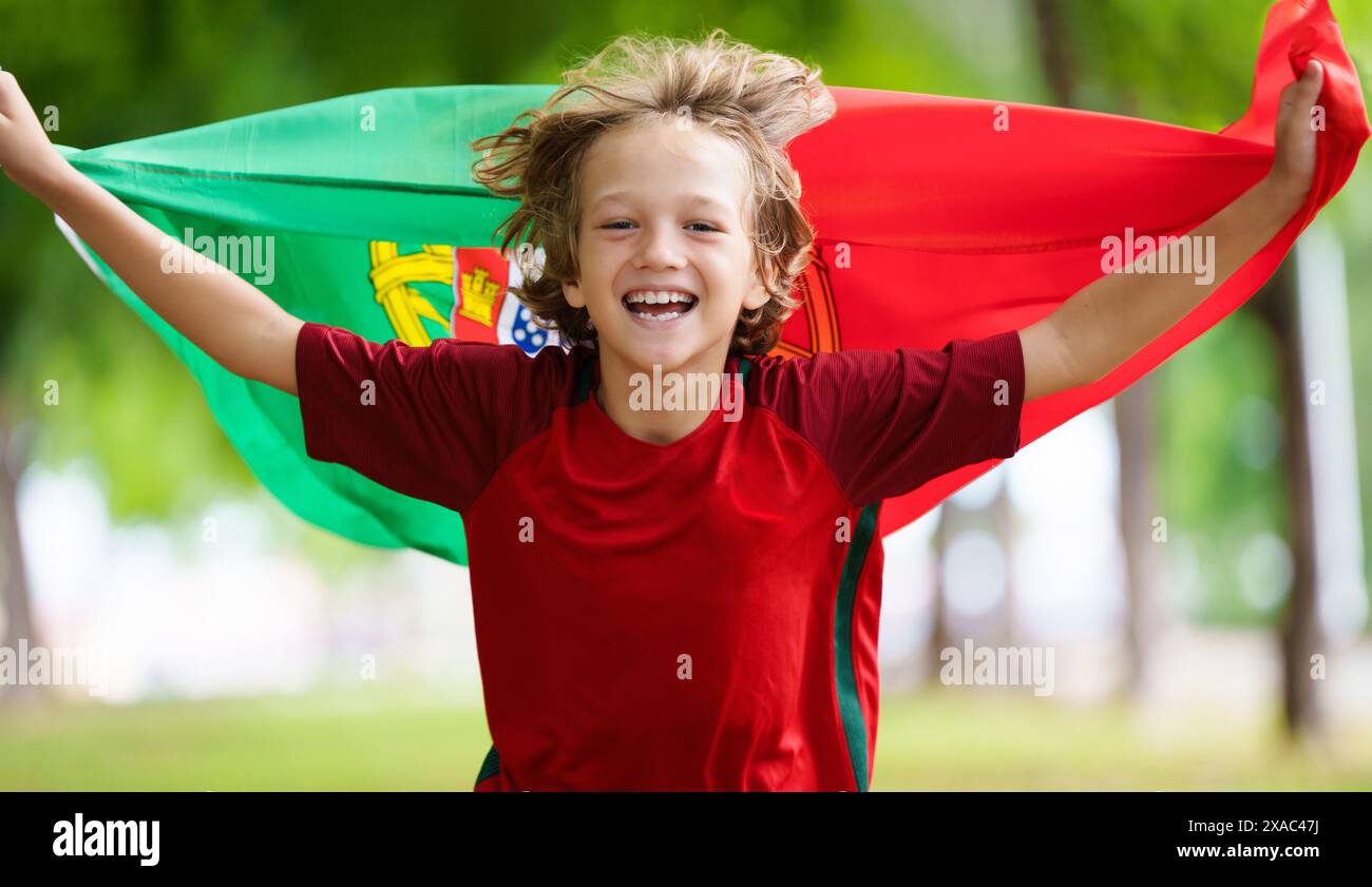 Portugal football supporter kid on stadium. Portuguese soccer fan boy ...