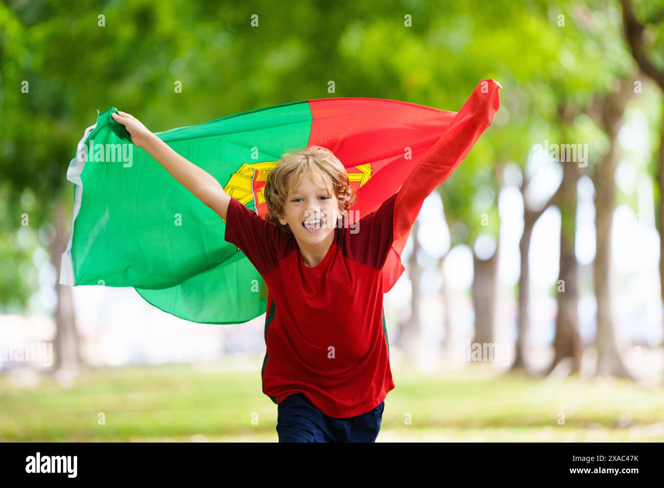 Portugal football supporter kid on stadium. Portuguese soccer fan boy ...