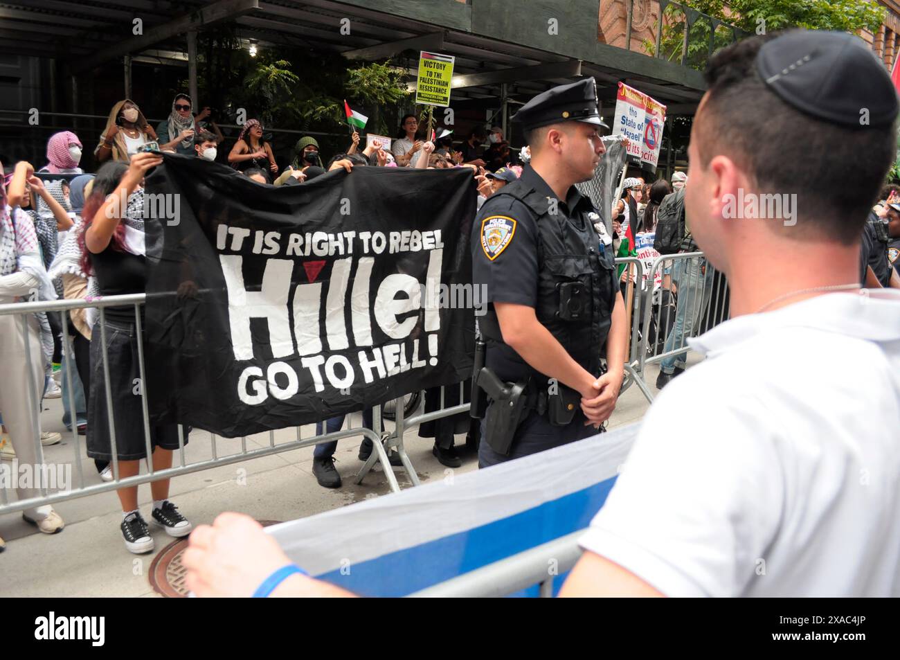 A pro-Israel demonstrator, right, rallies across from pro-Palestine ...