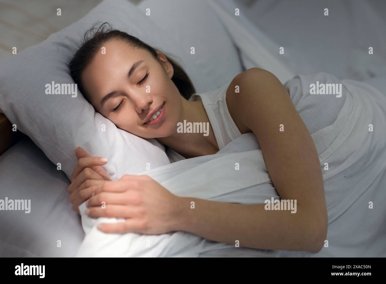 Girl sleeping in bed, morning sunbeam falling on face Stock Photo - Alamy