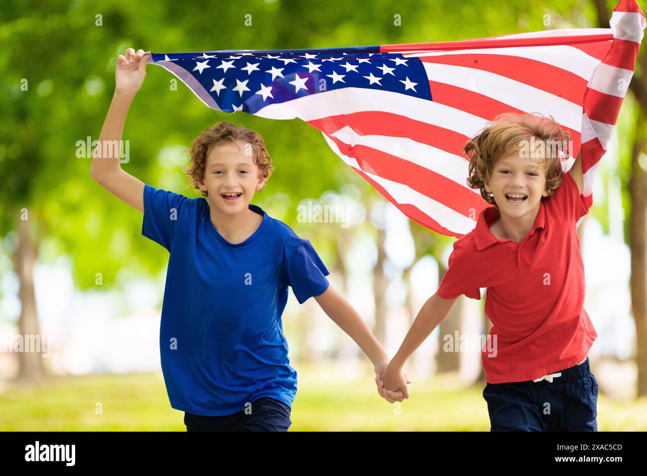 Happy 4th of July. USA supporter with national flag. Happy child ...