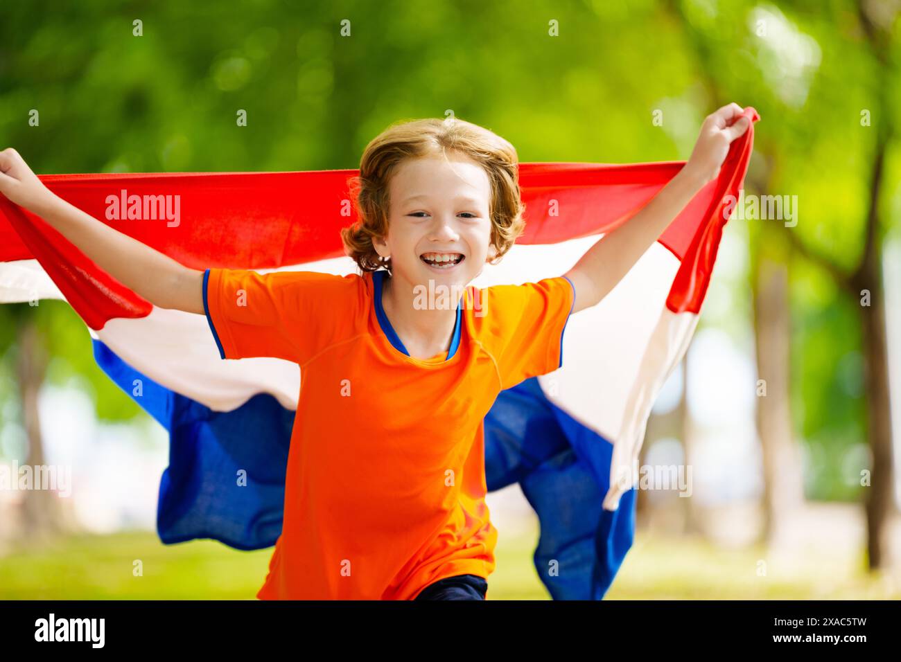 Netherlands football supporter child on stadium. Dutch fan kid running ...