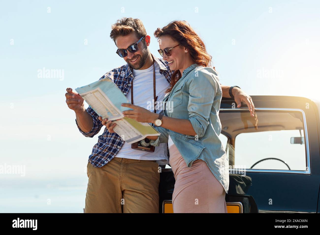 Reading, couple and map outdoor for navigation, location search and ...