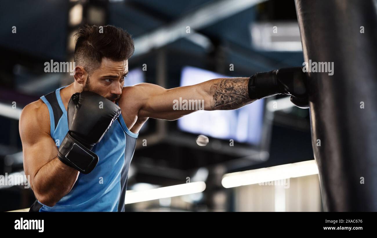 Boxer Training With Punching Bag in Gym Stock Photo - Alamy