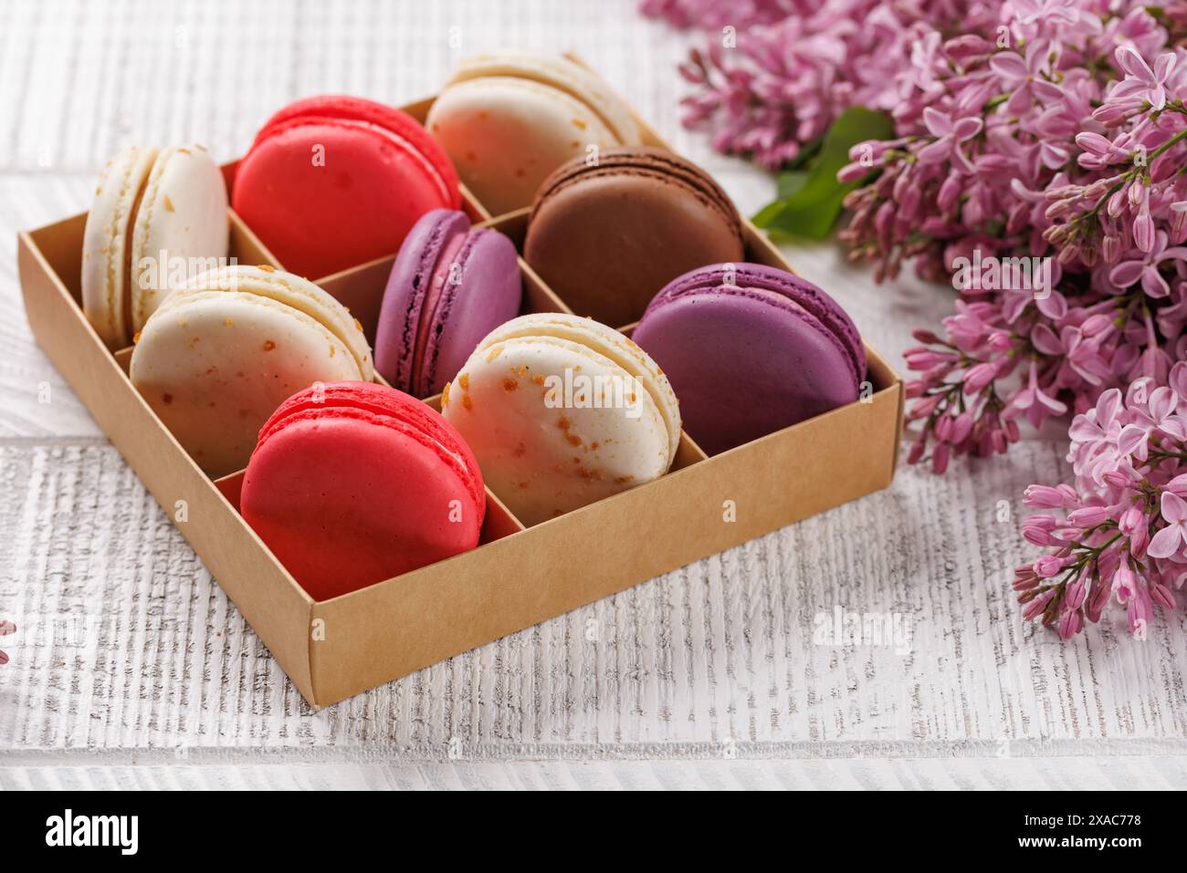 Colorful macaroons in box, arranged in a delightful display of vibrant ...