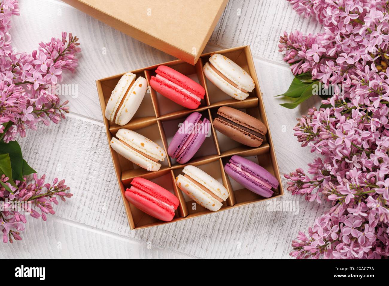 Colorful macaroons in box, arranged in a delightful display of vibrant ...
