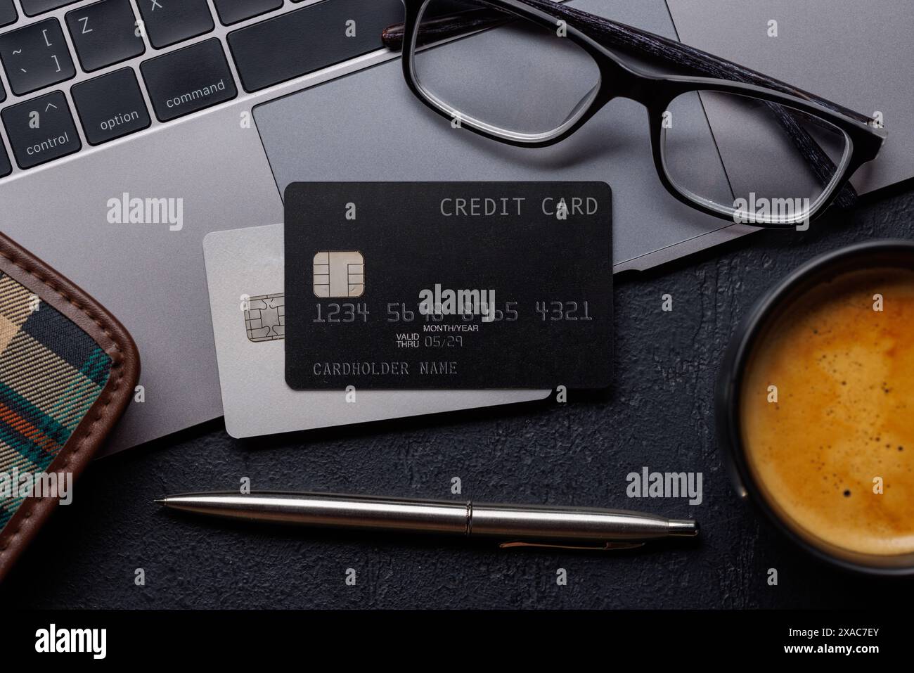 Black credit card on office table with supplies. Flat lay. Premium ...