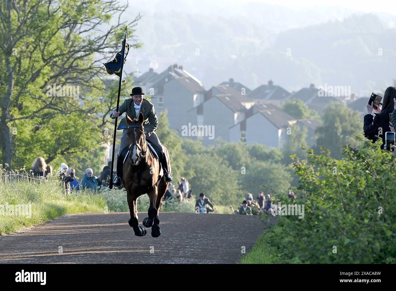 Ryan Nichol carries the unbussed 'Banner Blue' flag. Leads the ...